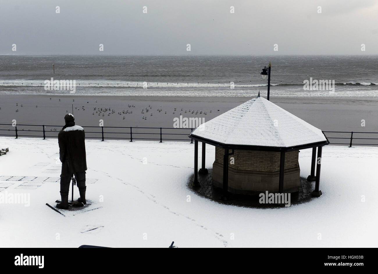 Snow covers the promenade at Filey on the East coast, as Scotland and ...