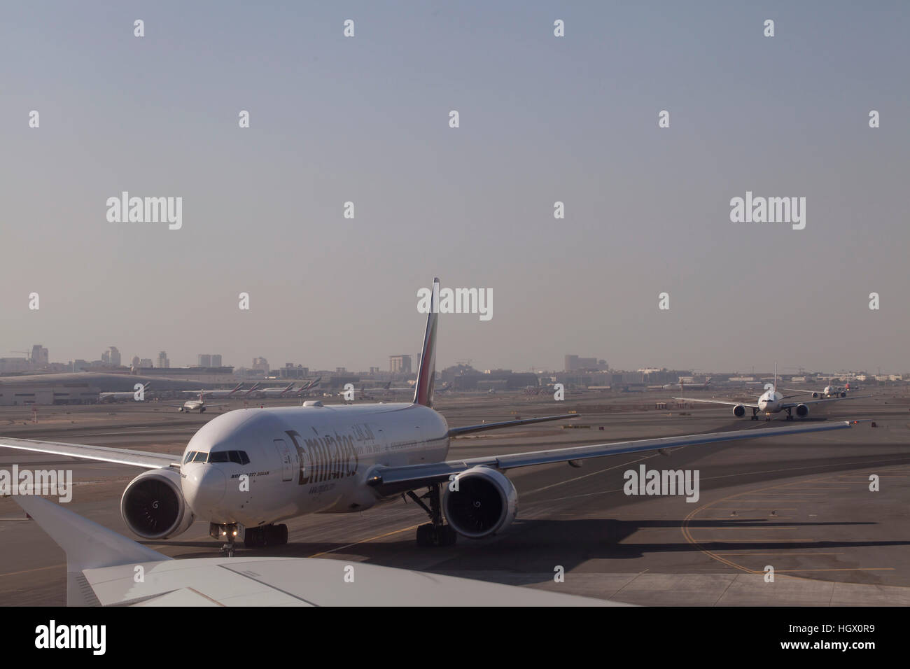 Dubai, UAE - January 6th, 2017:Dubai Airport. A queue of Emirate planes ...