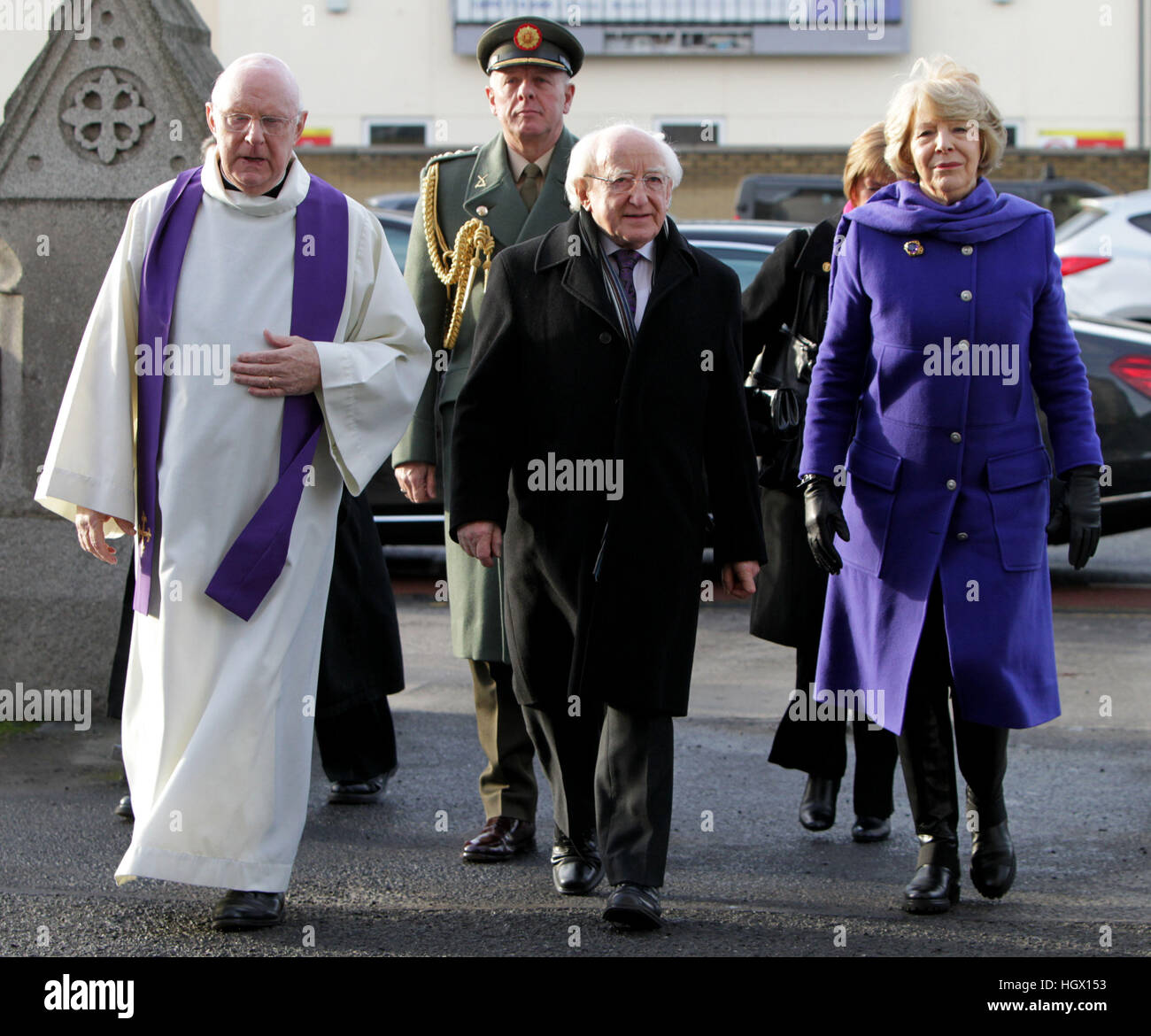 President Michael D. Higgins and his wife Sabina arrive at the funeral ...
