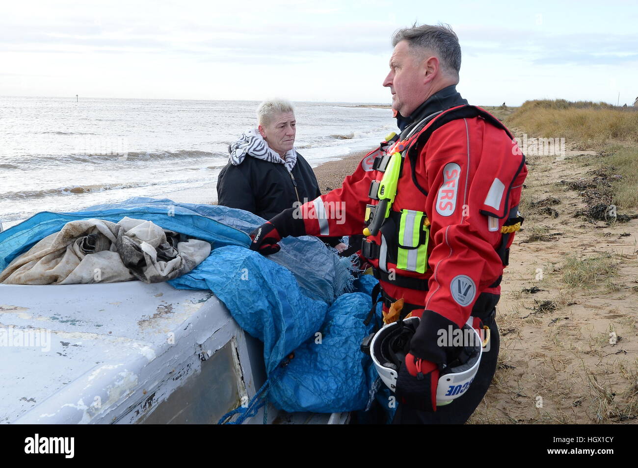 Sarah Stott talking to the Fire Rescue Service on Jaywick beach, Essex ...