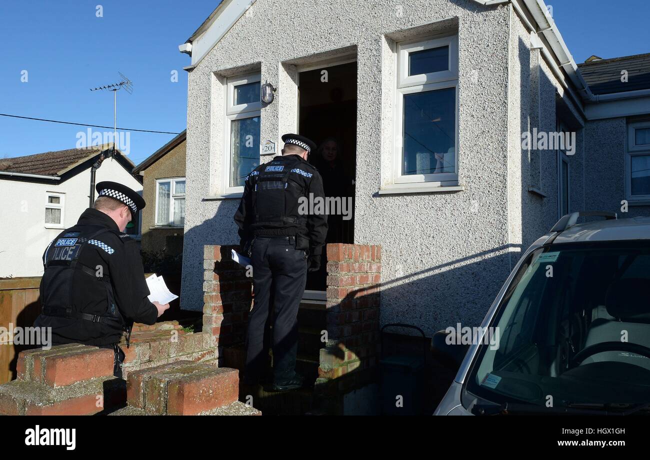 Police officers telling local residents in Jaywick, Essex about the ...