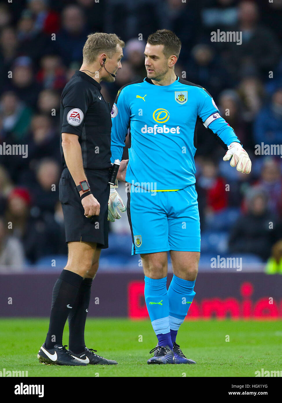 Referee Graham Scott speaks with Burnley goalkeeper Tom Heaton Stock ...