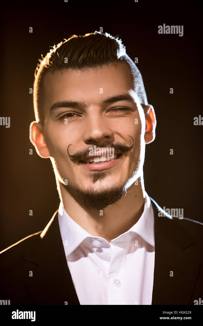 Man winking close up hi-res stock photography and images - Alamy