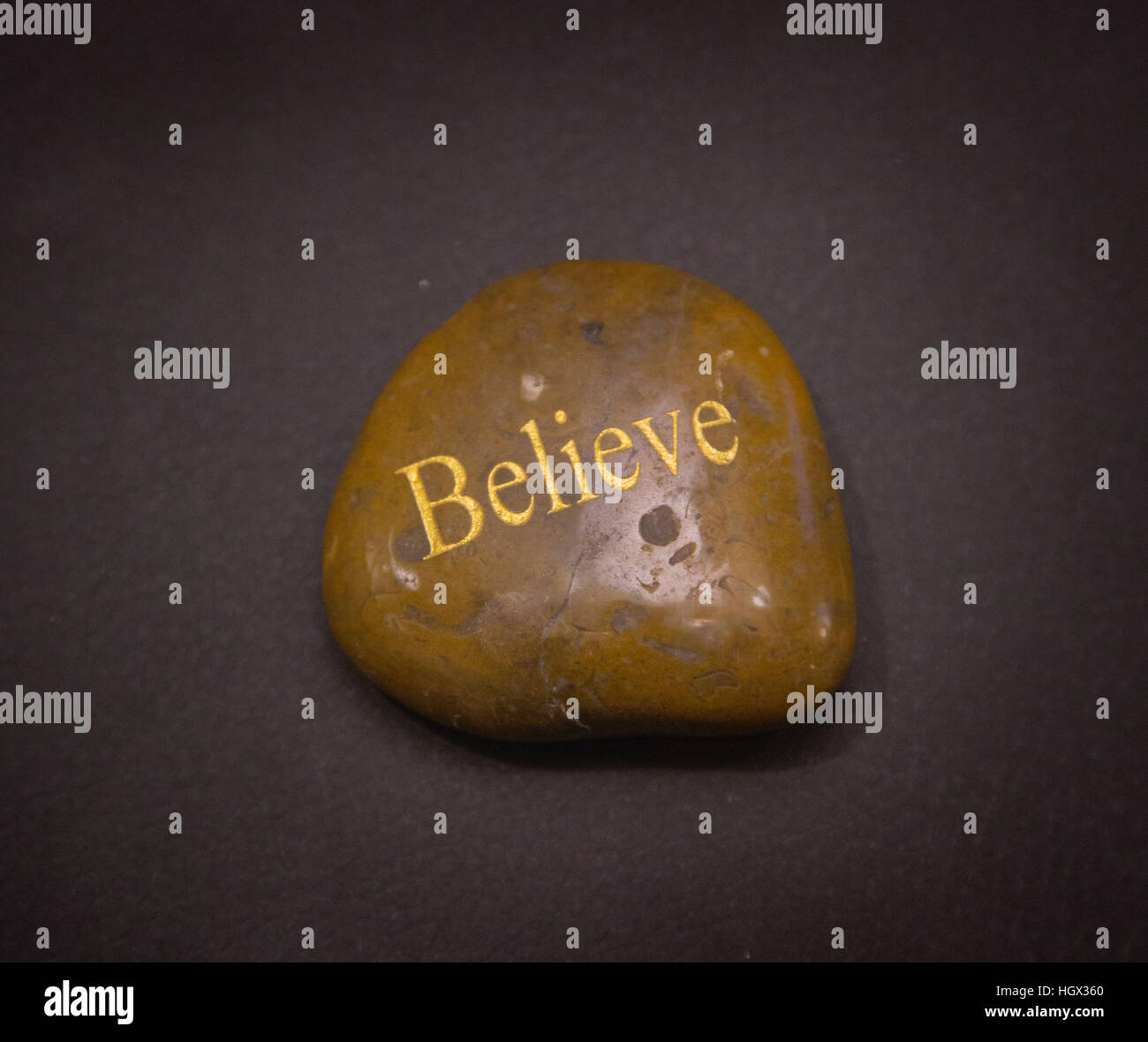 Inspirational Stone - believe Stock Photo - Alamy