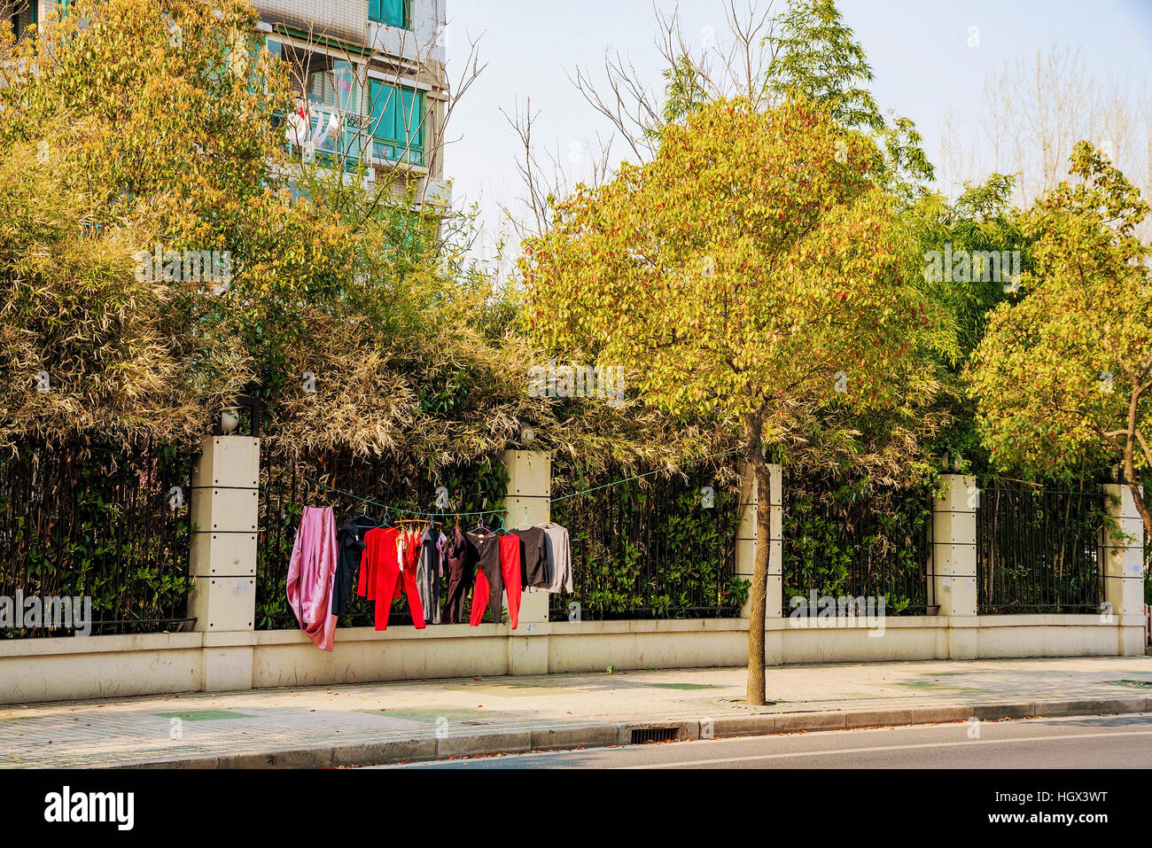 Washing line on a residential street in Shanghai Stock Photo - Alamy