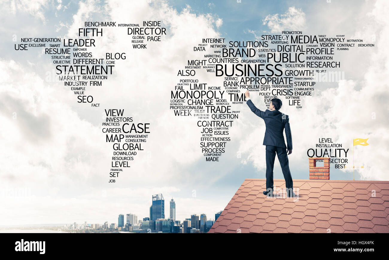 Businessman on brick roof draw world map as concept of globaliza Stock ...
