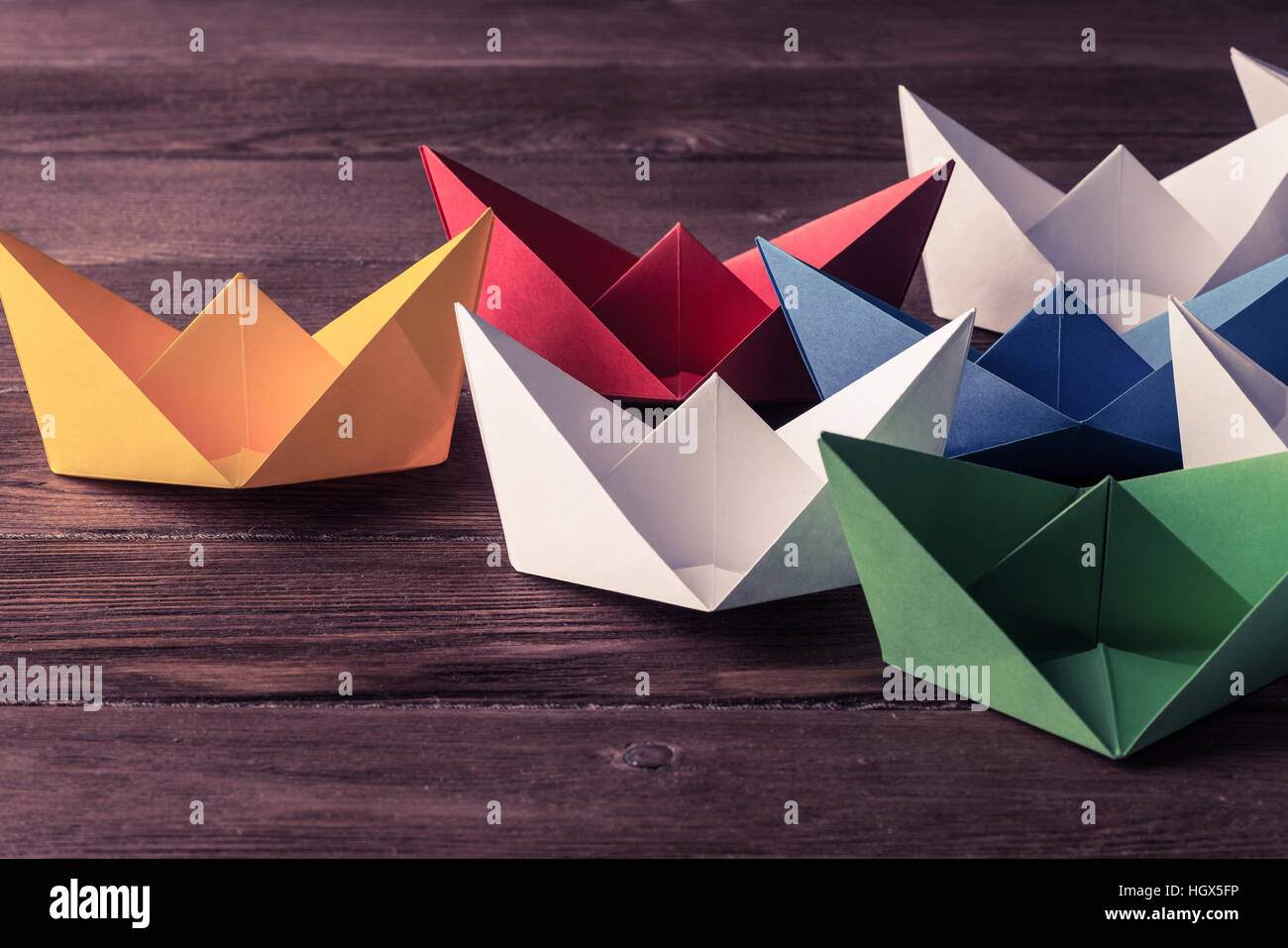 Business leadership concept with white and color paper boats on Stock ...