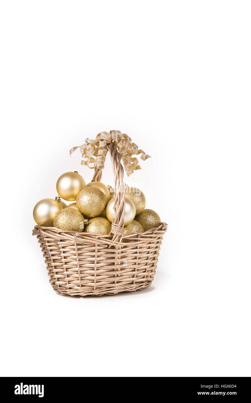 Gold wicker basket with gold balls and ribbons Stock Photo - Alamy