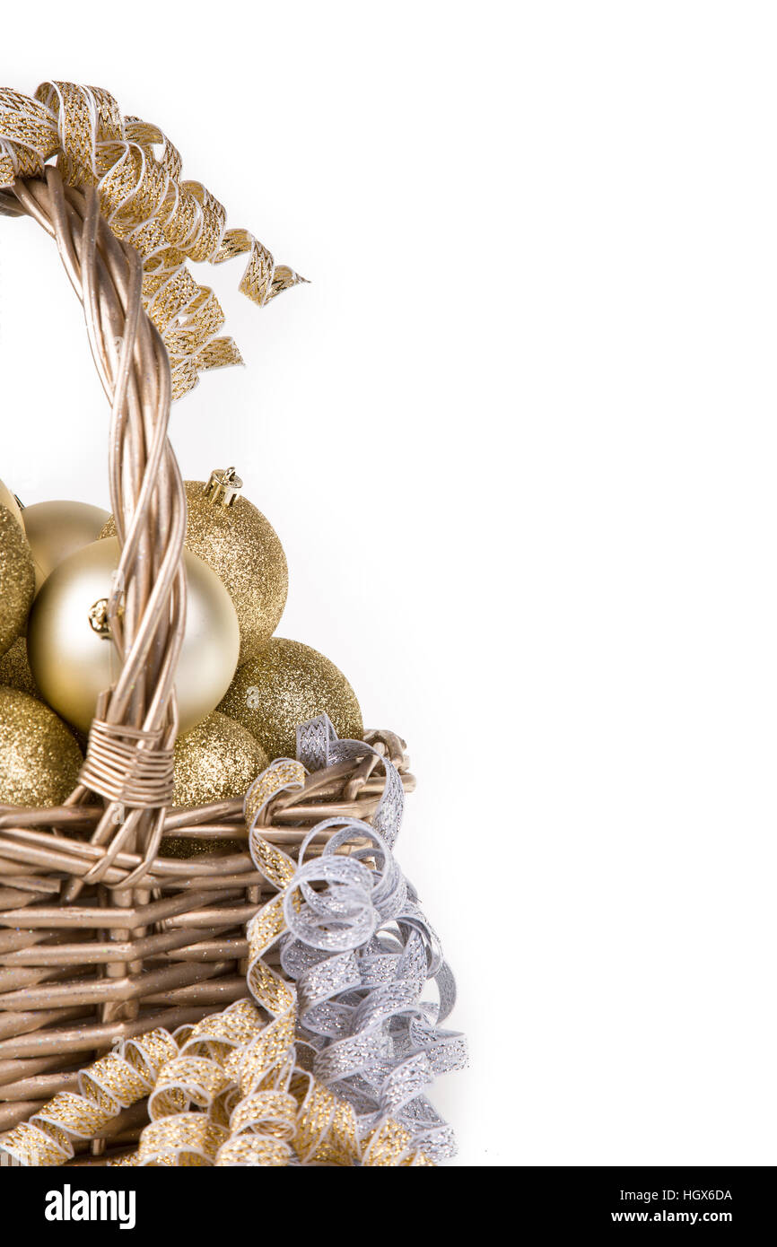 Gold wicker basket with gold balls and ribbons Stock Photo - Alamy