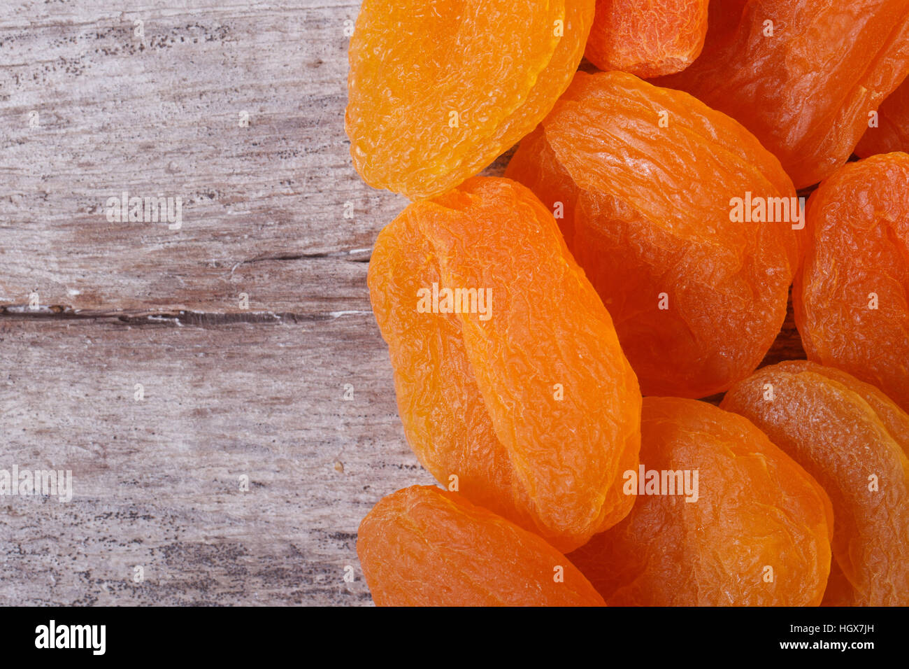 Dried apricots on yellow hi-res stock photography and images - Alamy