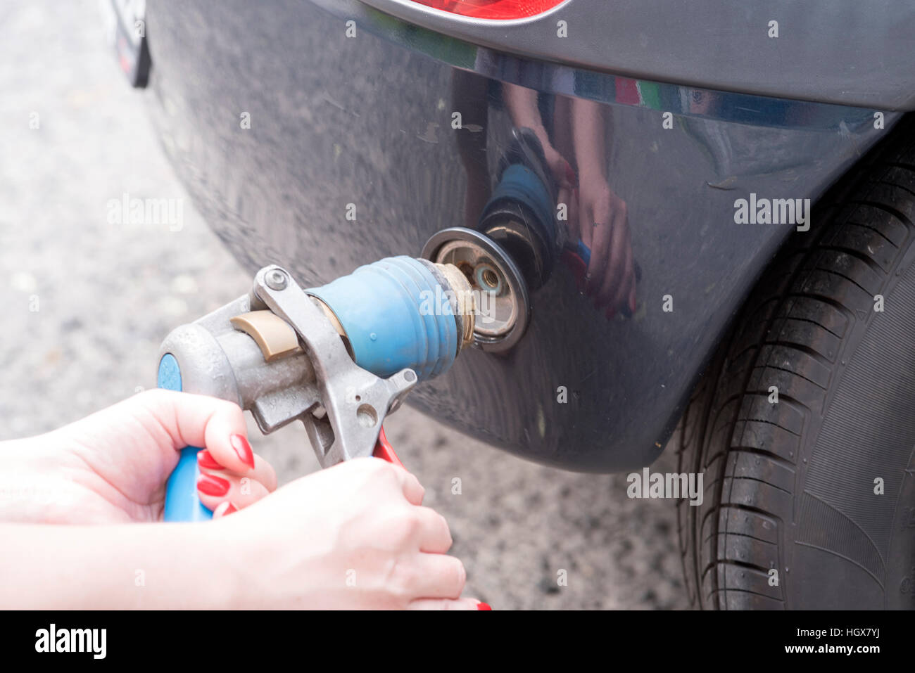car at gas station being filled with fuel Stock Photo - Alamy