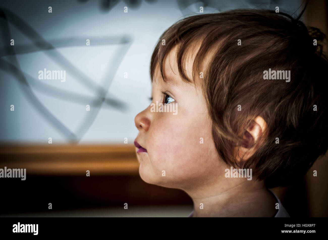 Baby girl looking concerned Stock Photo - Alamy
