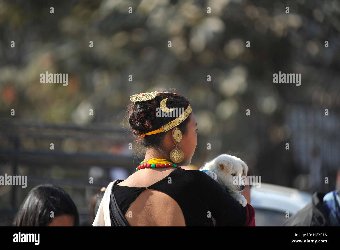 Kathmandu, Nepal. 14th Jan, 2017. A Nepalese Magar girl hold her dog in ...