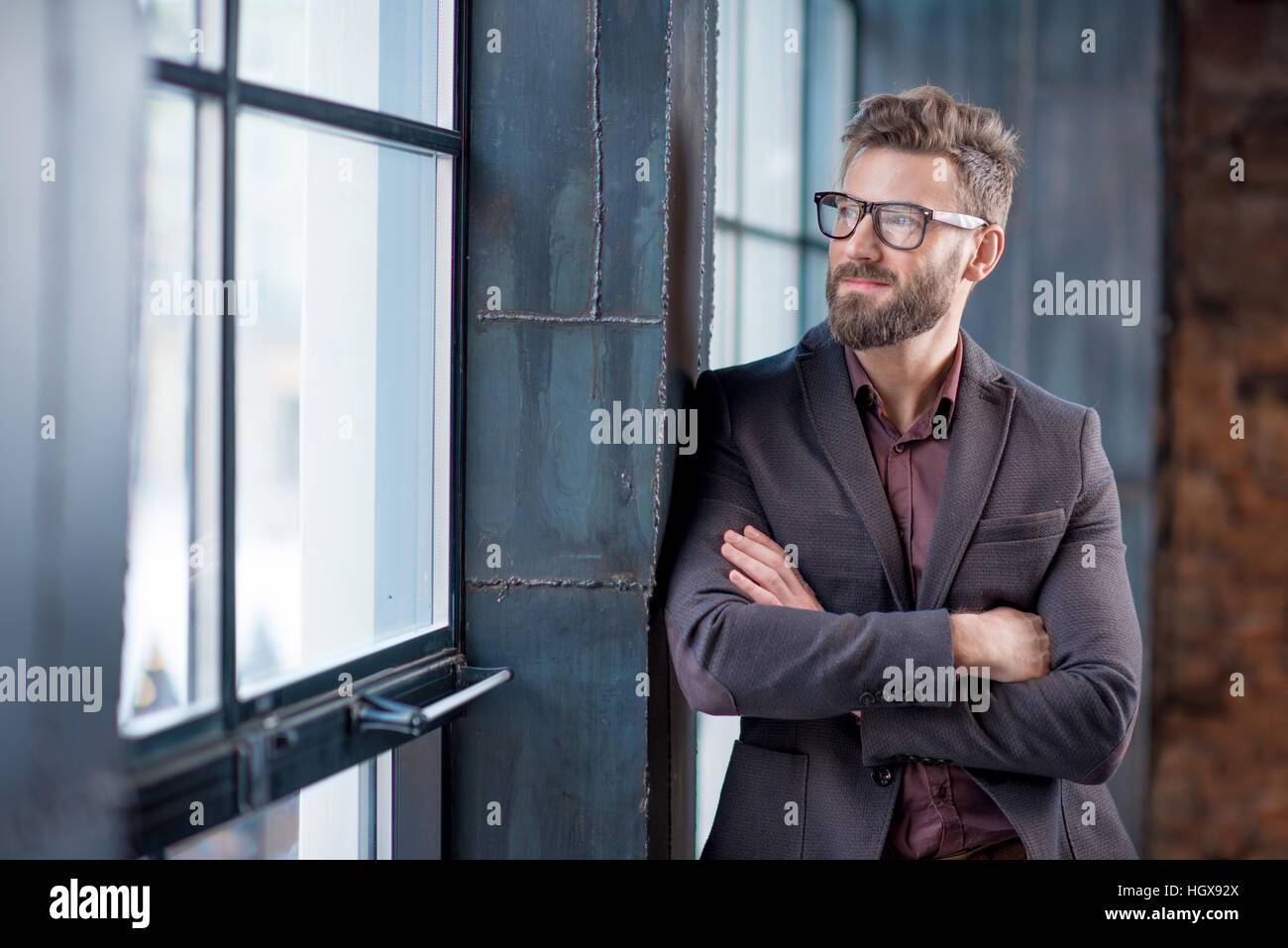 Portrait of businessman near the window Stock Photo - Alamy