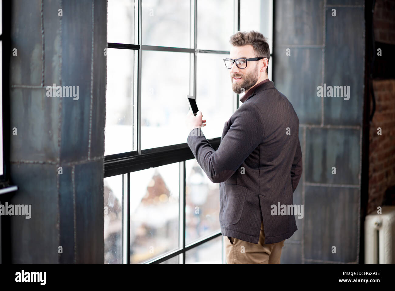 Businessman near the window Stock Photo - Alamy