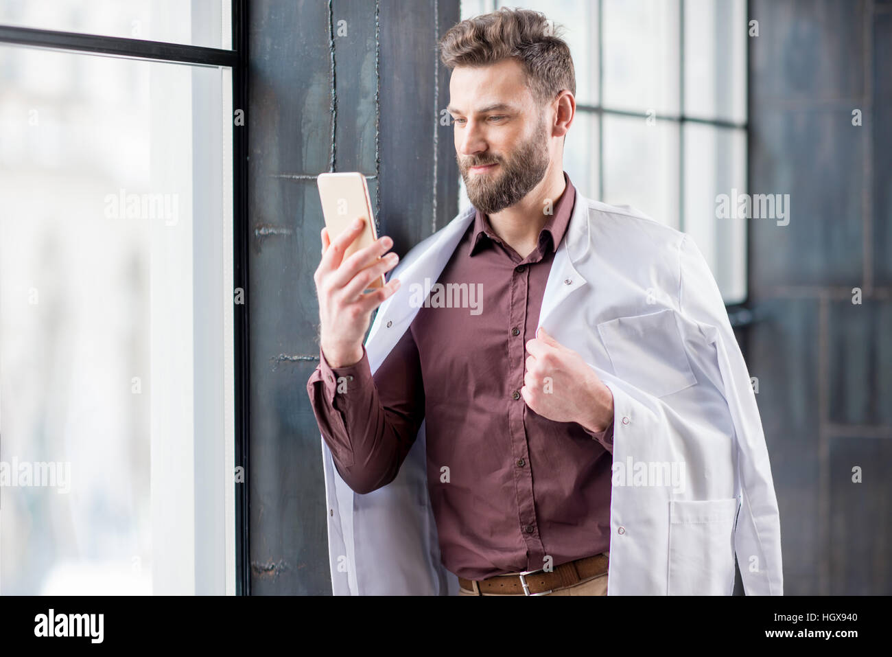 Portrait of a doctor near the window Stock Photo - Alamy