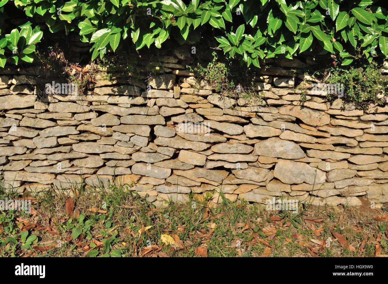 Solid wall made of stone Stock Photo - Alamy