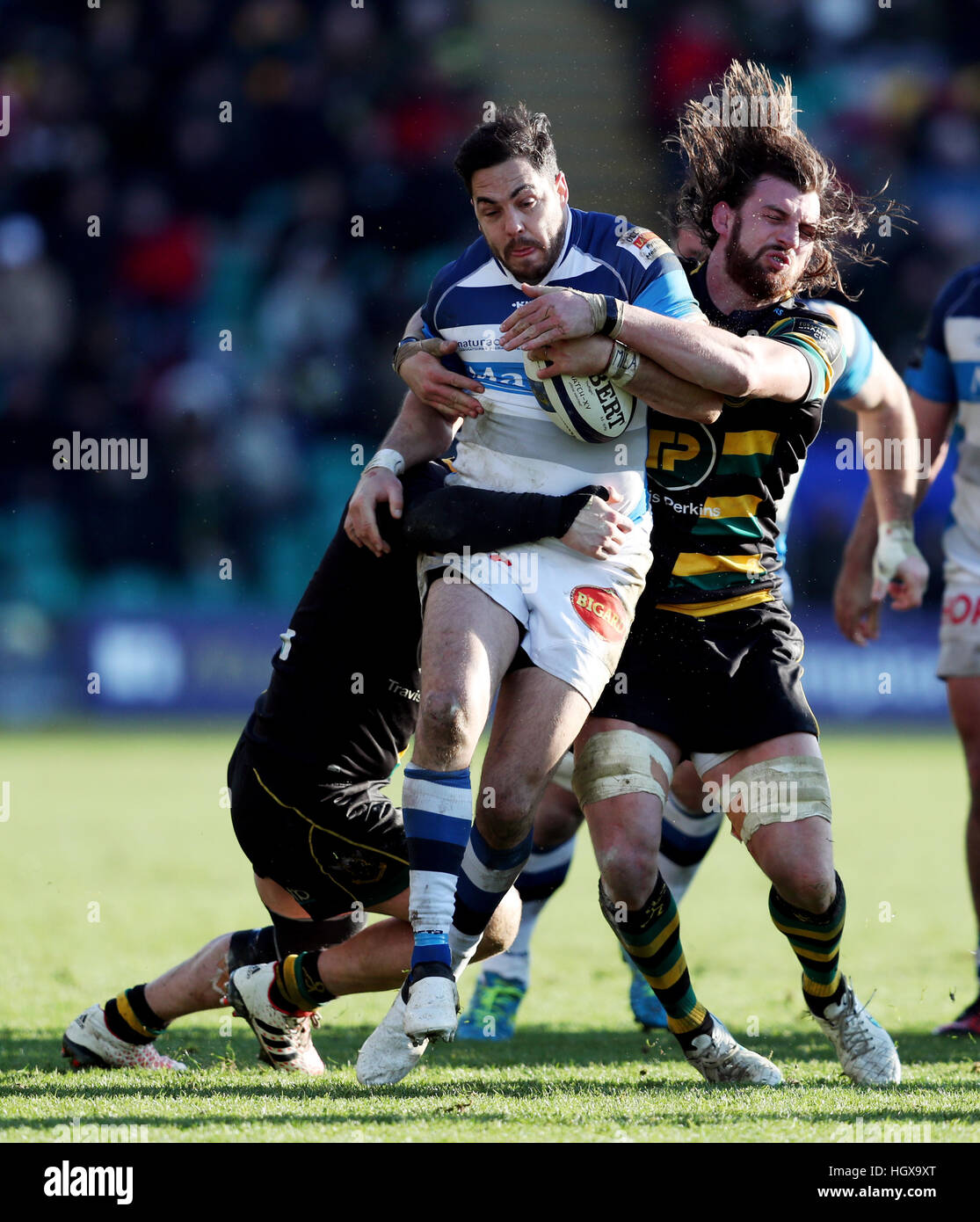 Castres' Horacio Agulla is tackled by Northampton Saints' Tom Wood ...