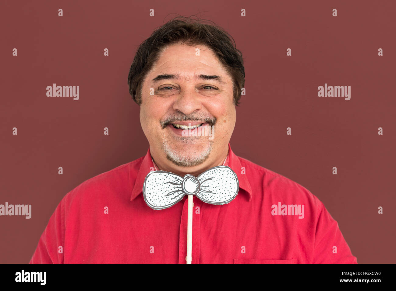 Latino guy smiling studio portrait Stock Photo - Alamy
