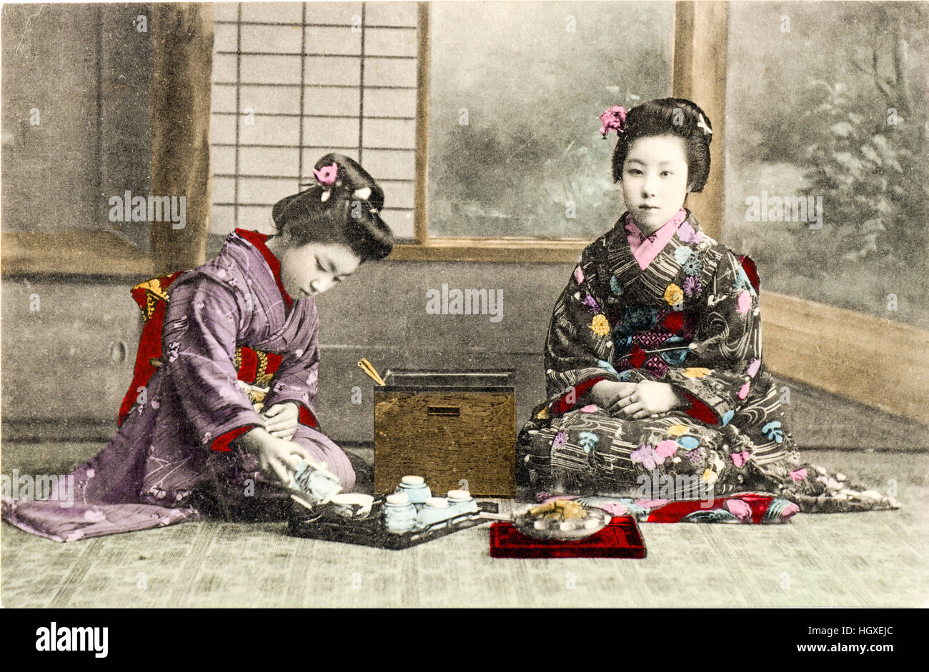 Japan, Vintage postcard hand coloured. Two Geisha in kimono sitting in ...