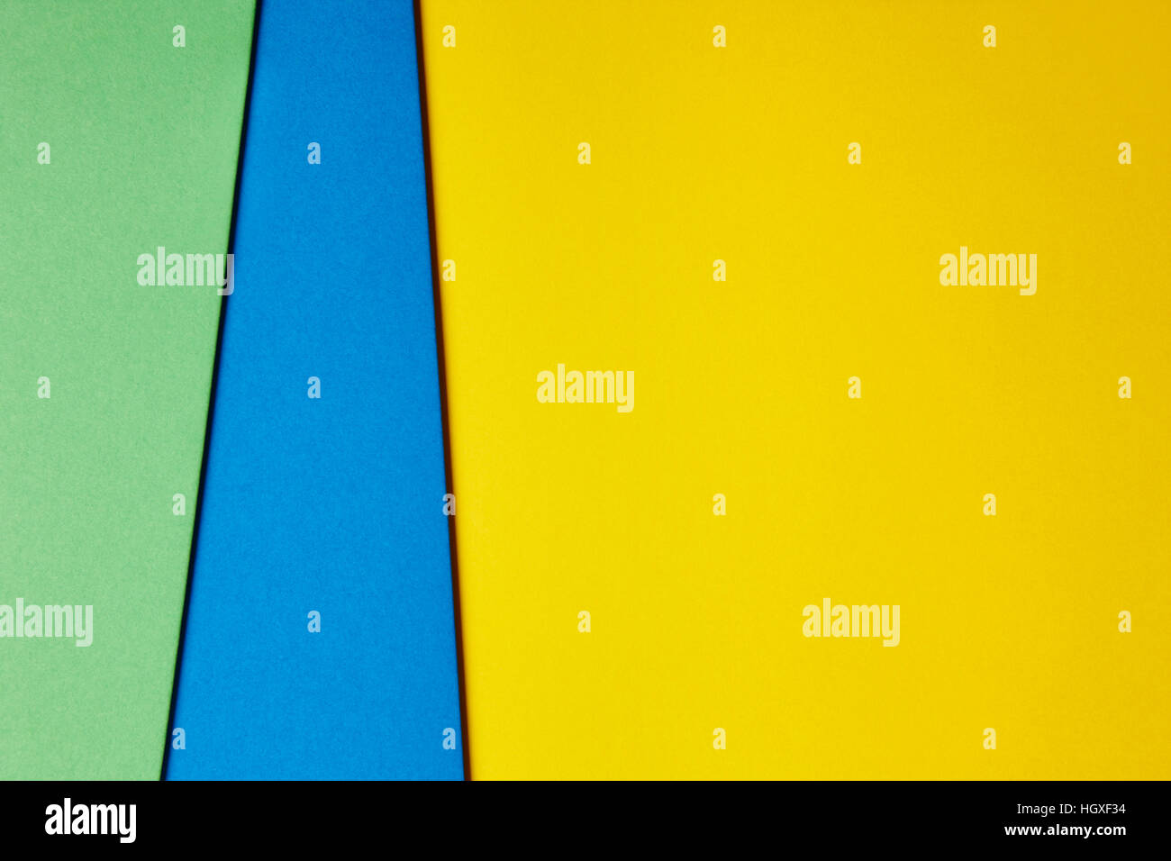 Colored cardboards background in yellow blue green tone. Copy space ...
