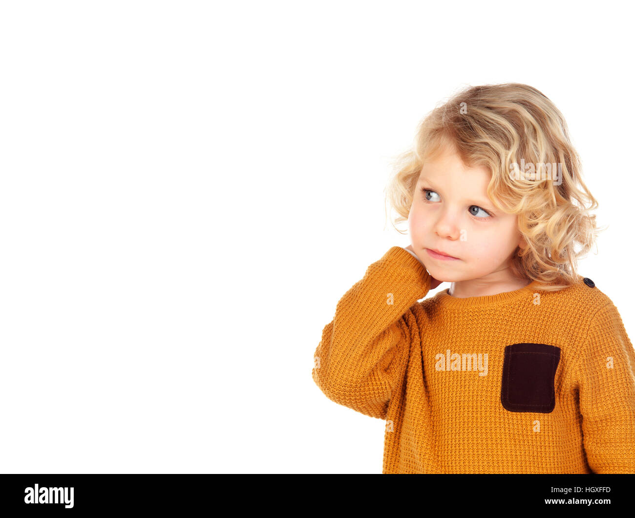 Sad small boy scratching his head isolated on a white background Stock ...