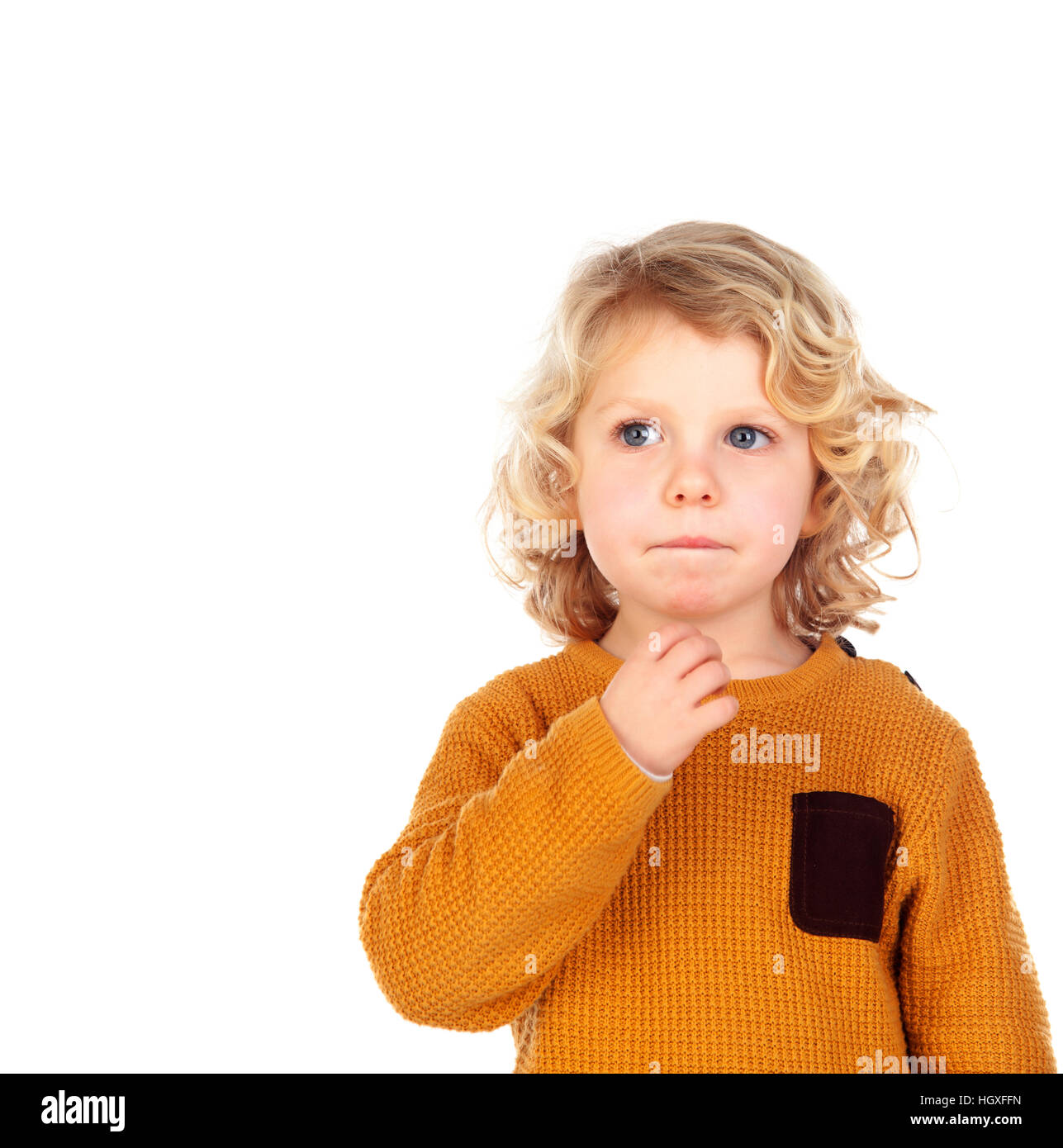 Shy small child with yellow jersey isolated on a white background Stock ...
