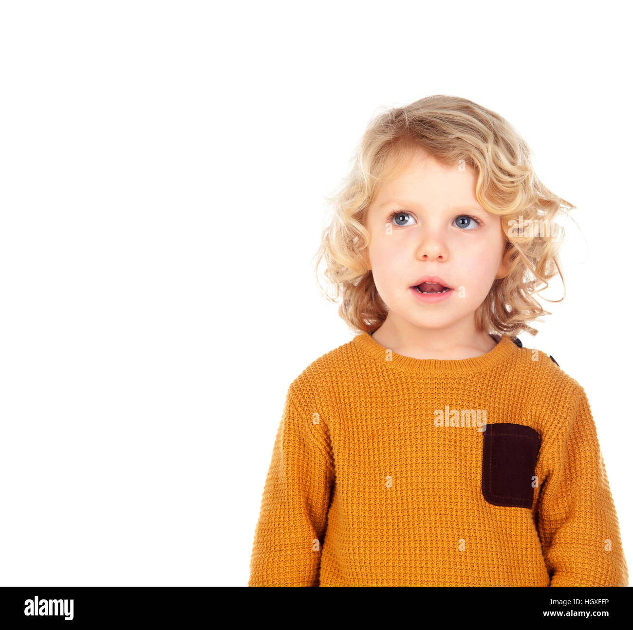 Shy small child with yellow jersey isolated on a white background Stock ...