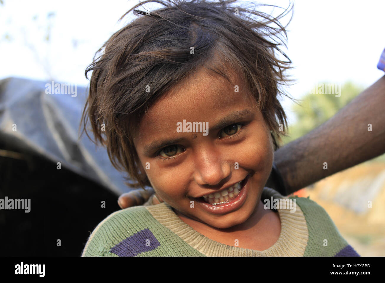 Portrait of a poor little innocent girl. Wow moment. Homeless kid Stock ...