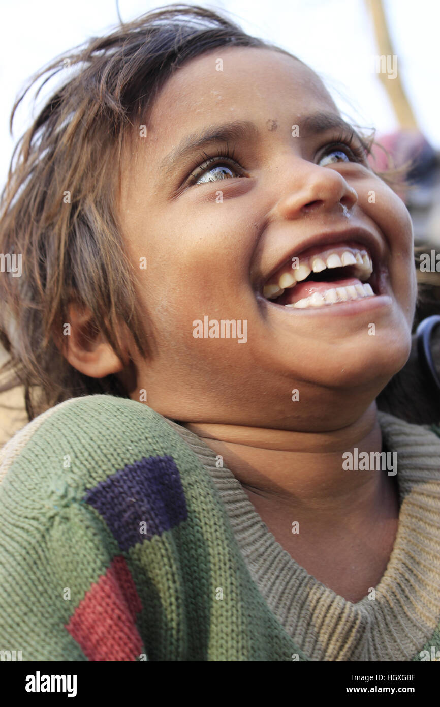 Portrait of a poor little innocent girl. Wow moment. Homeless kid Stock ...