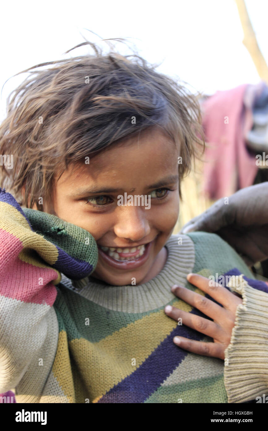 Portrait of a poor little innocent girl. Wow moment. Homeless kid Stock ...