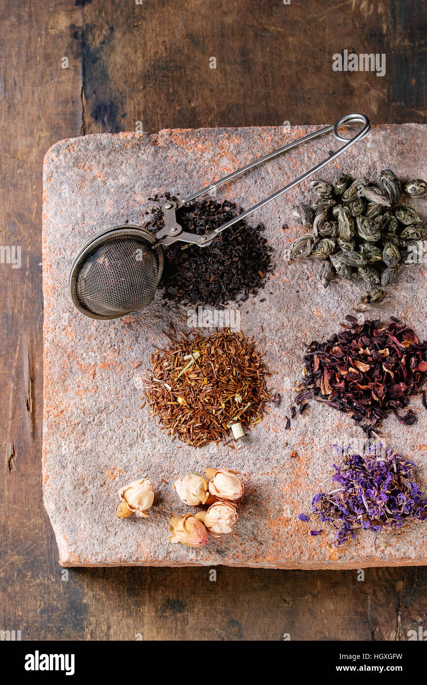 Variety of dry tea with teapot Stock Photo - Alamy