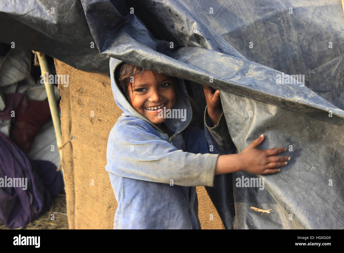 Portrait of a poor little innocent girl. Wow moment. Homeless kid Stock ...