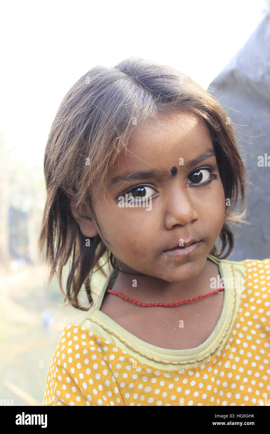 Portrait of a poor little innocent girl. Wow moment. Homeless kid Stock ...