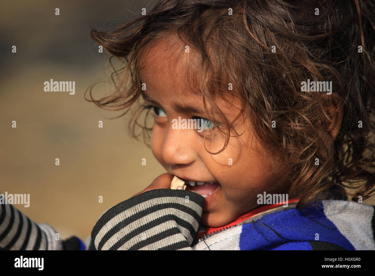 Portrait of a poor little innocent girl. Wow moment. Homeless kid Stock ...