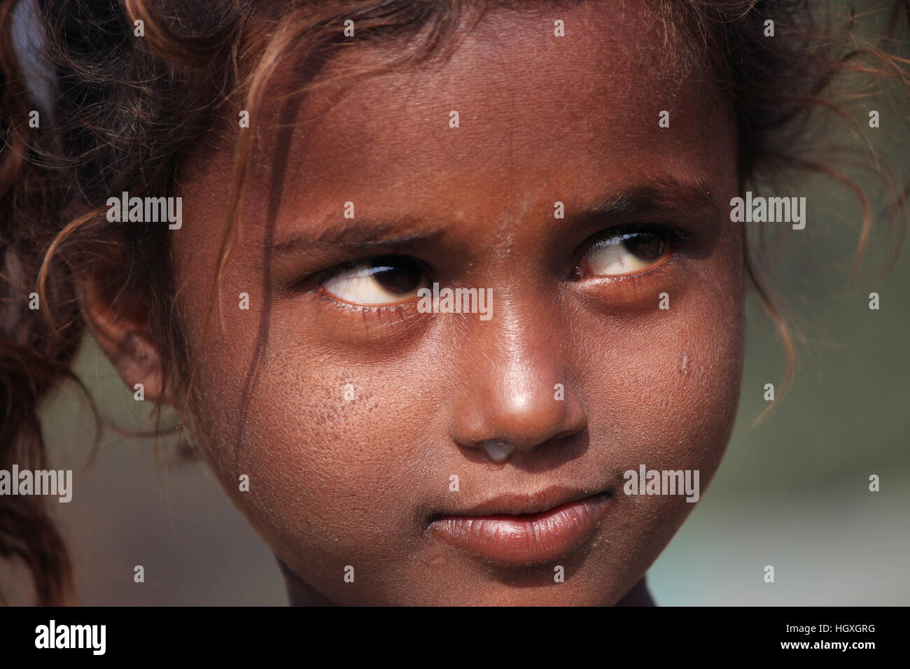 Portrait of a poor little innocent girl. Wow moment. Homeless kid Stock ...