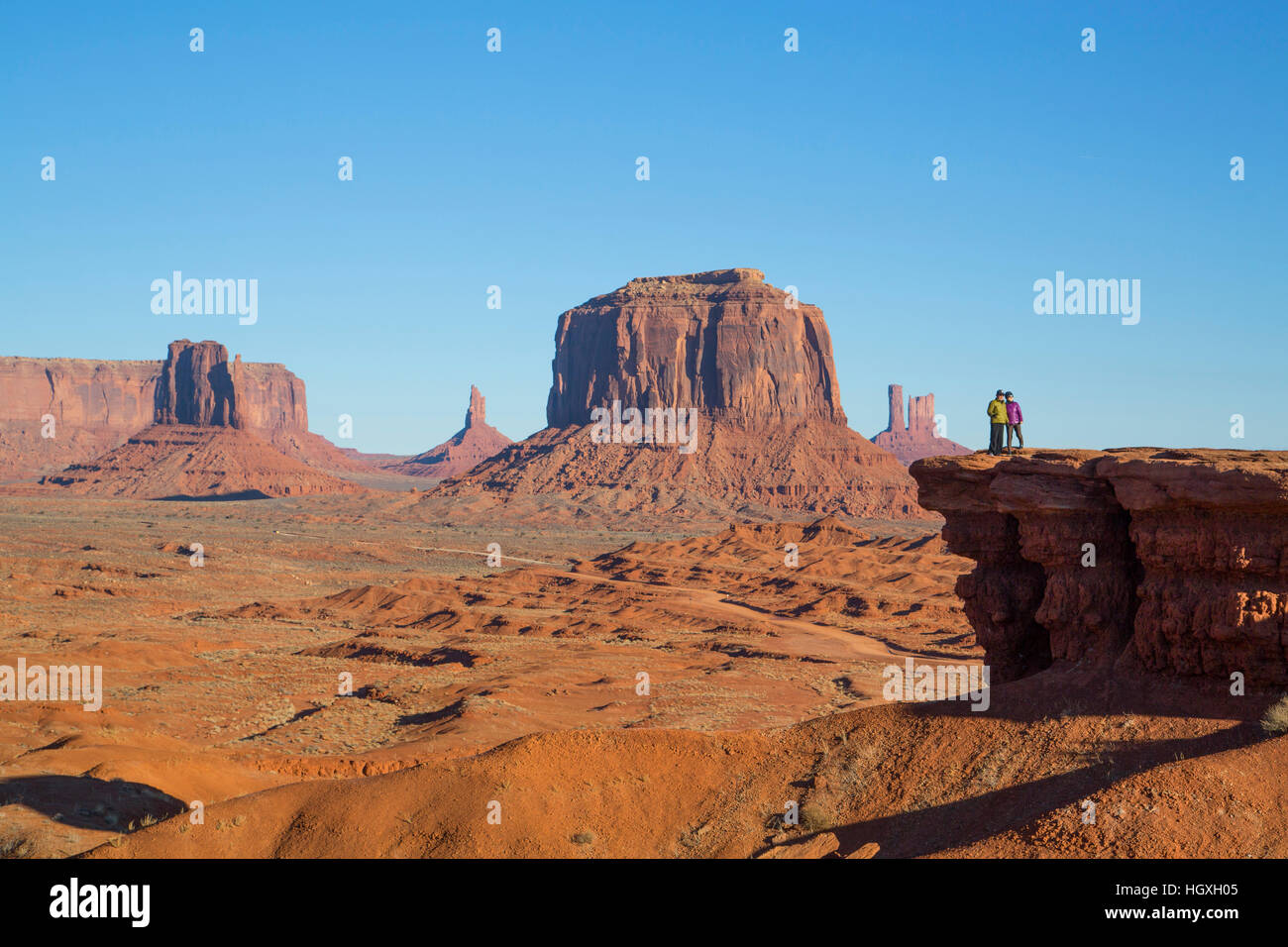 Tourists, John Ford Point (foreground), Merrick Butte (background ...