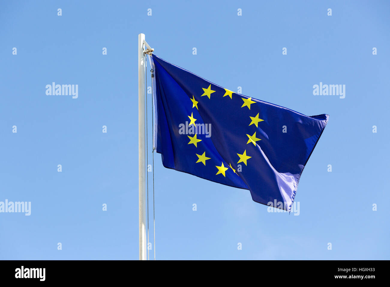 Flag of European Union on a flagpole in front of blue sky Stock Photo ...