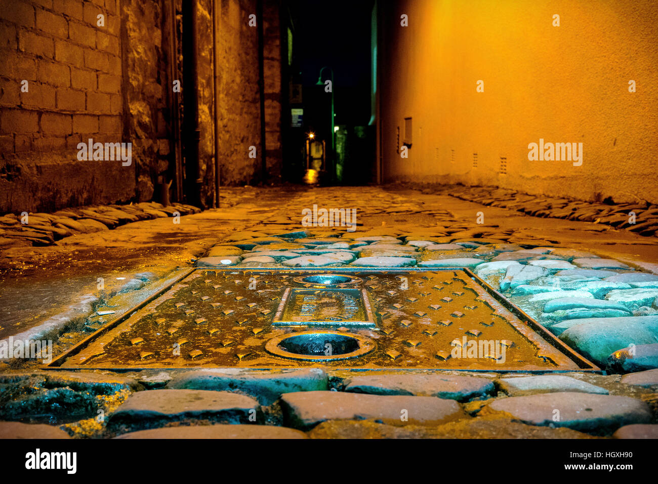 Water manhole cover in a cobbled street hi-res stock photography and ...