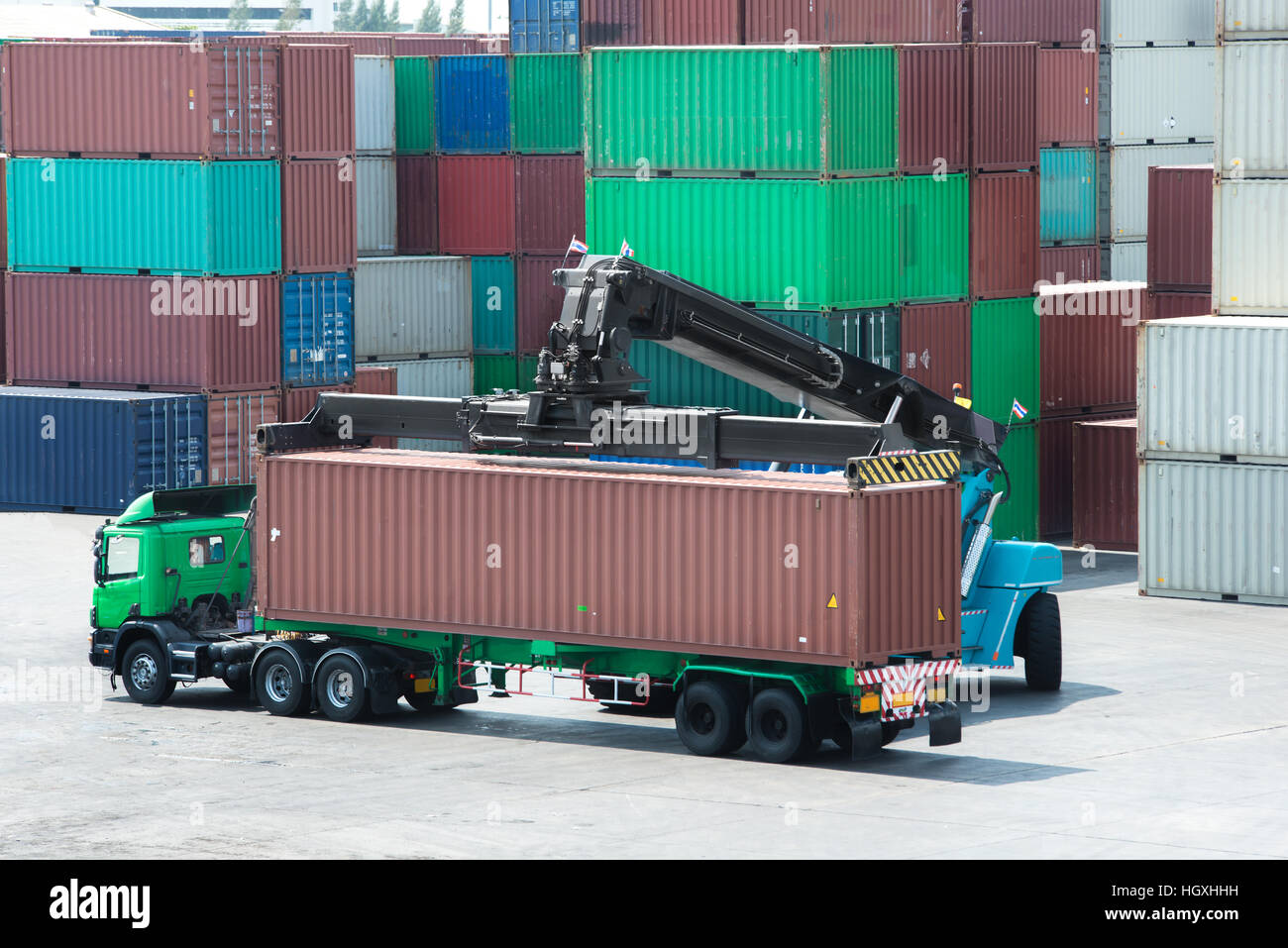 Forklift lift container box loading to truck in depot use for import ...