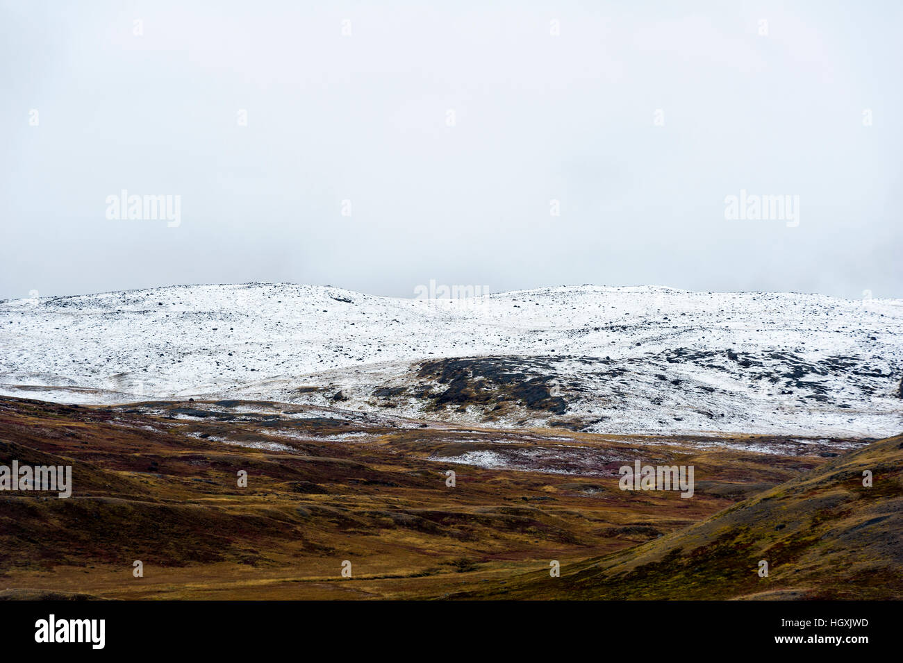 Autumn's first dusting of snow on low hills over the tundra Stock Photo ...