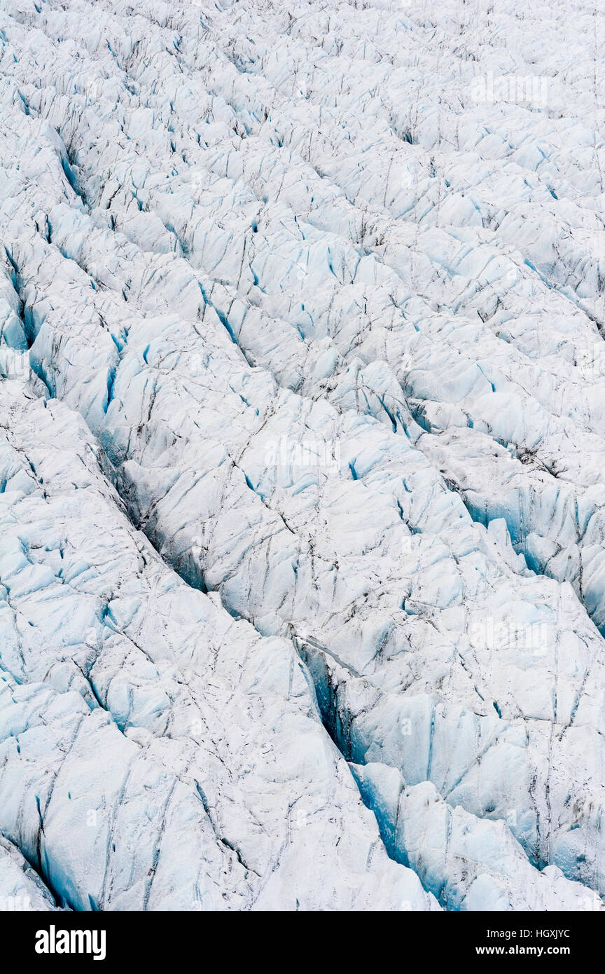 Pressure ridges and crevasse scar the surface of a glacier on the ...