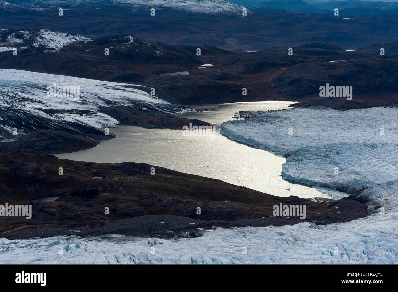 An ice-marginal lake surrounded by the Greenland Ice Sheet Stock Photo ...