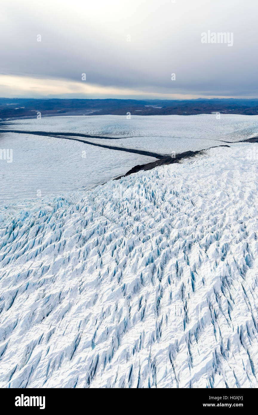Pressure ridges and crevasse scar the surface of a glacier on the ...