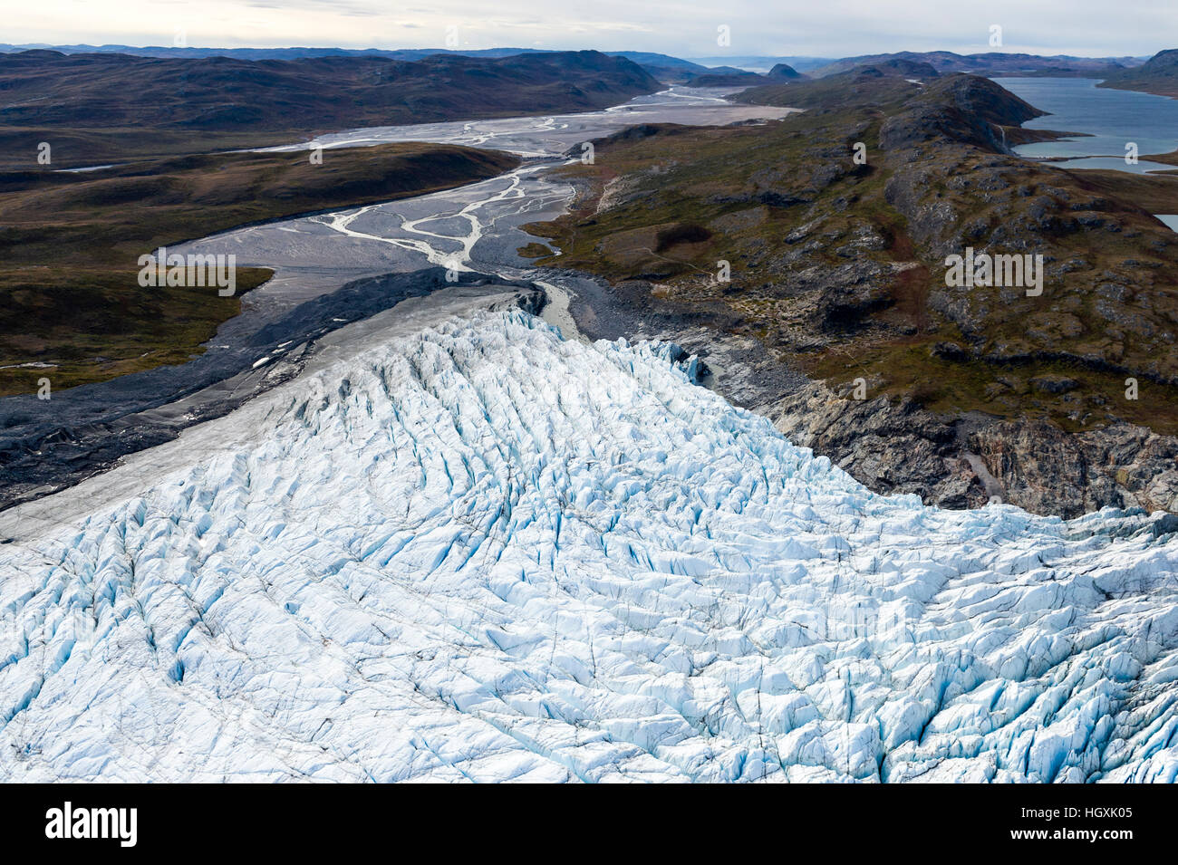 Pressure ridges and crevasse scar the surface of a glacier on the ...