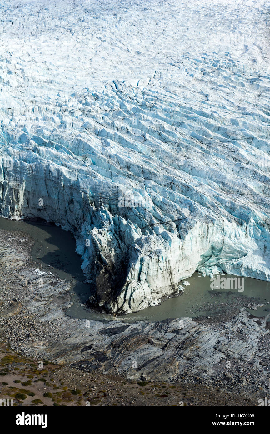 Pressure ridges and crevasse scar the surface of a glacier on the ...
