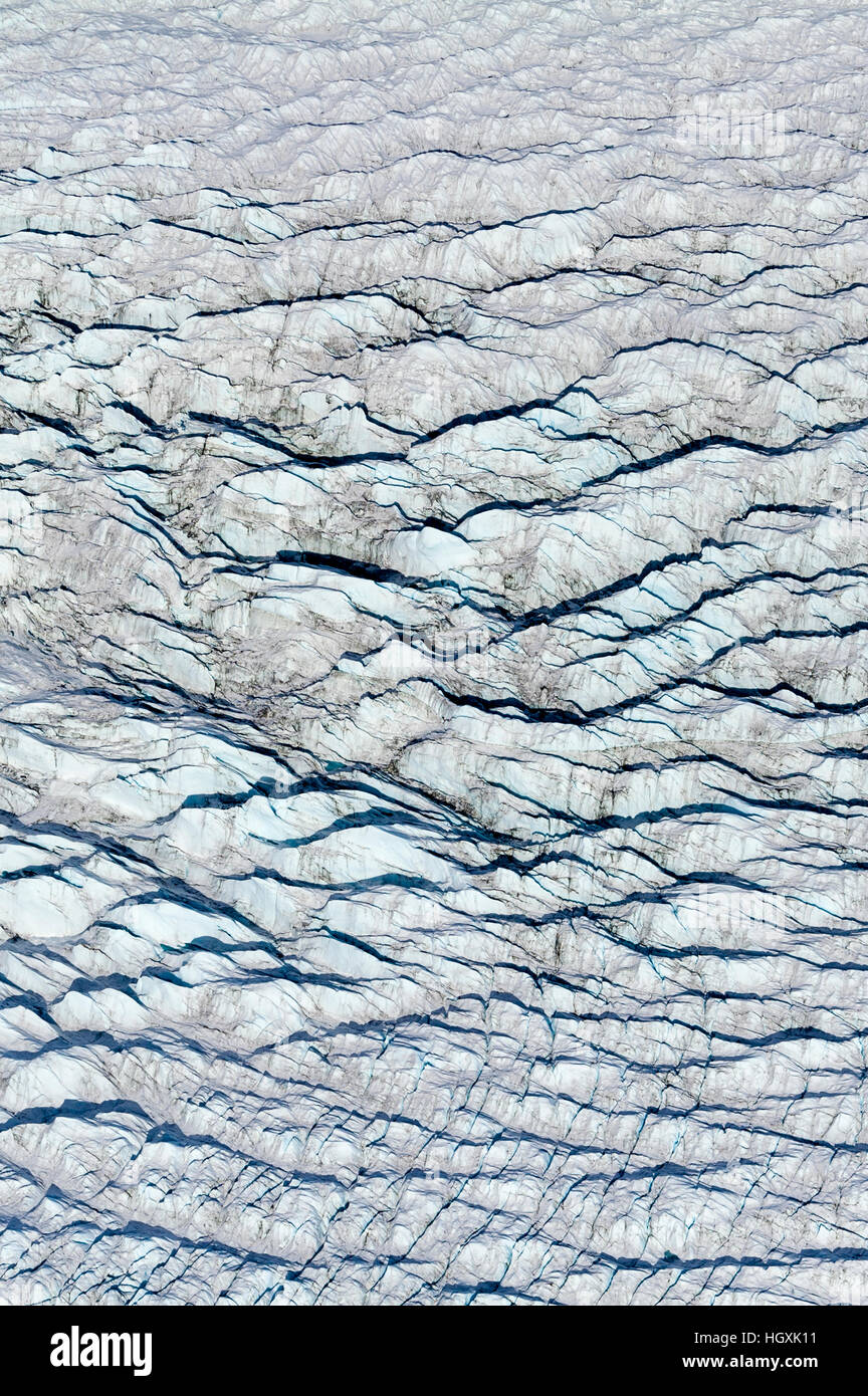 Pressure ridges and crevasse scar the surface of a glacier on the ...