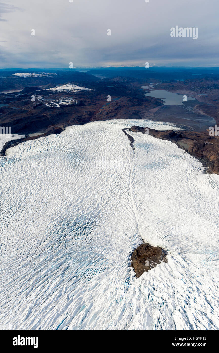 Pressure ridges in a glacier build up around an island in the Greenland ...