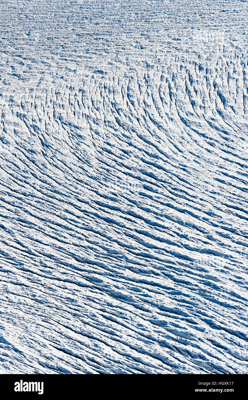 Pressure ridges and crevasse scar the surface of a glacier on the ...