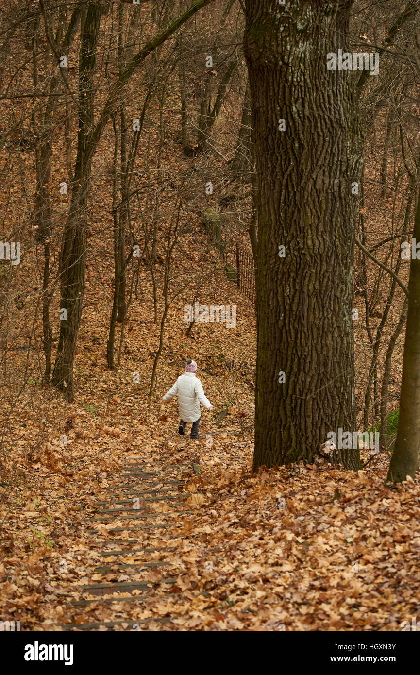 Little child in the forest Stock Photo - Alamy